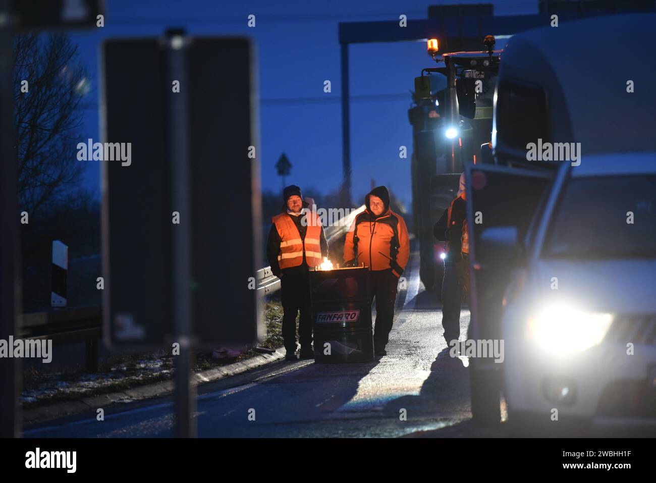 Rostock, Germany. 11th Jan, 2024. Convoys of tractors block the Rostock ...