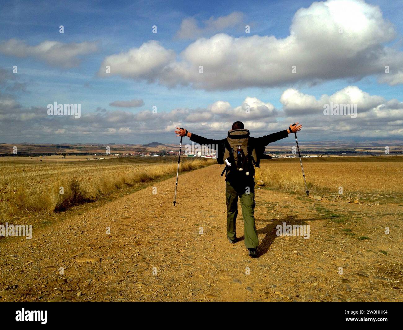Man from the back walking with open hands. Wide hug gesture. Active ...