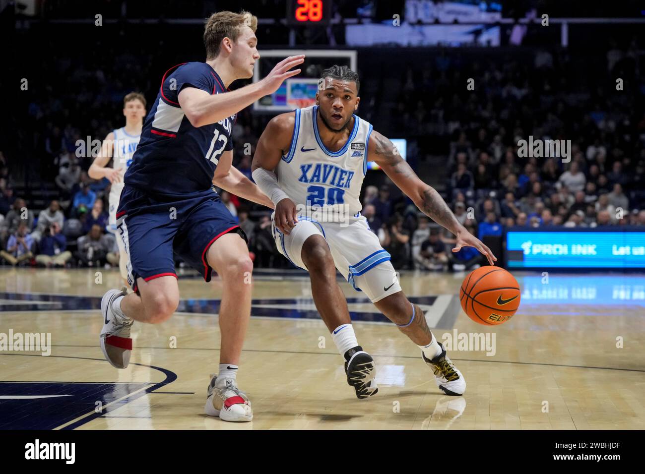 Xavier's guard Dayvion McKnight (20) dribbles the ball against UConn ...