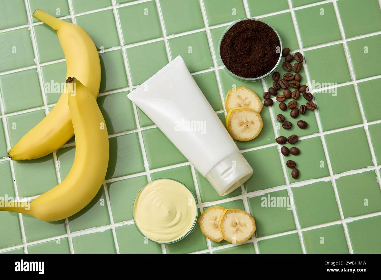 Glass petri dishes of coffee powder and cream texture. Unlabeled white ...