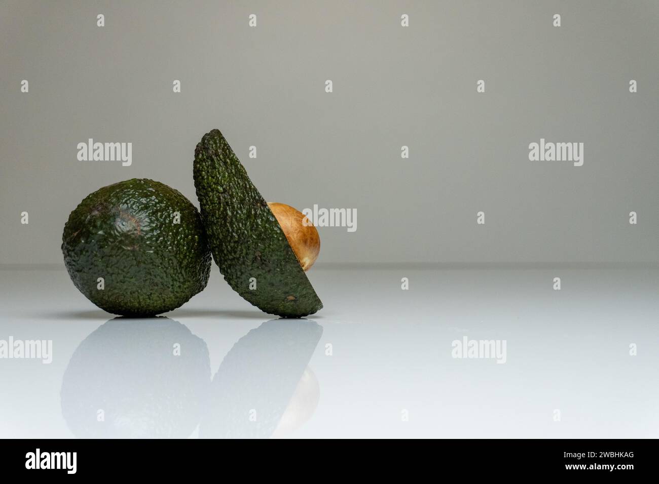 Captivating photograph featuring a fresh avocado placed on a white ...