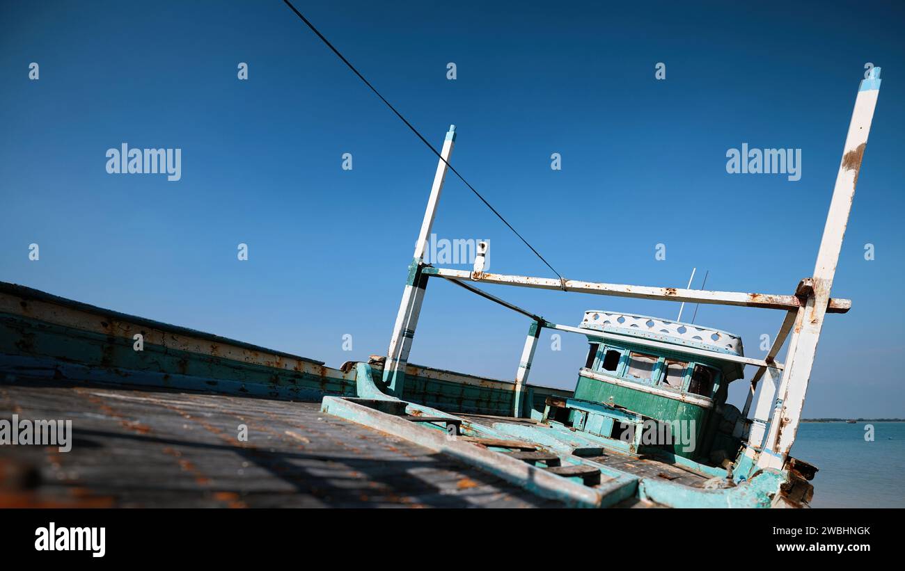 Traditional Dhow old wooden boat in the harbor of Iranian Qeshm Island ...