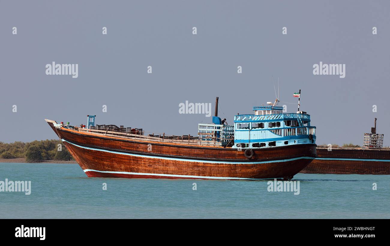 Traditional Dhow old wooden boat in the harbor of Iranian Qeshm Island ...