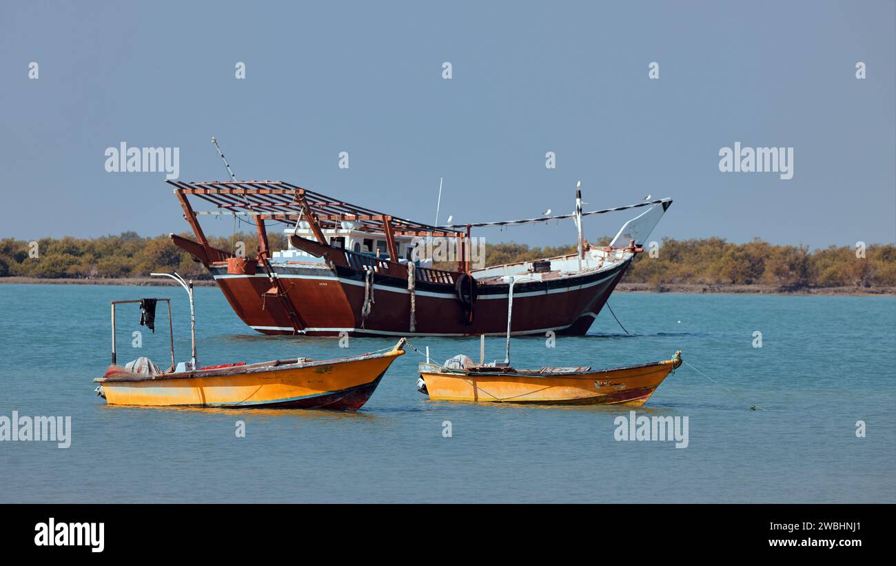 Traditional Dhow old wooden boat in the harbor of Iranian Qeshm Island ...