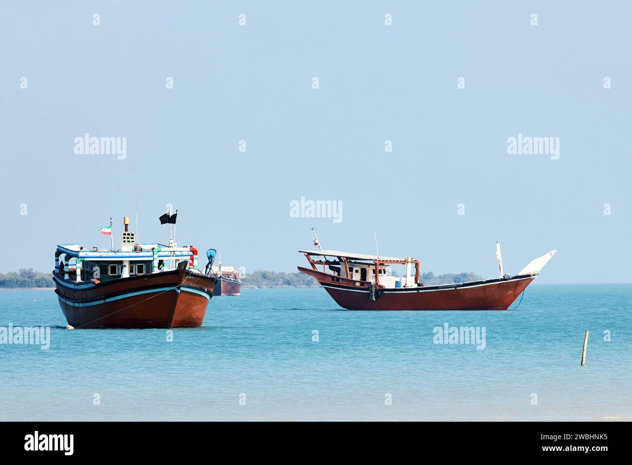 Traditional Dhow old wooden boat in the harbor of Iranian Qeshm Island ...