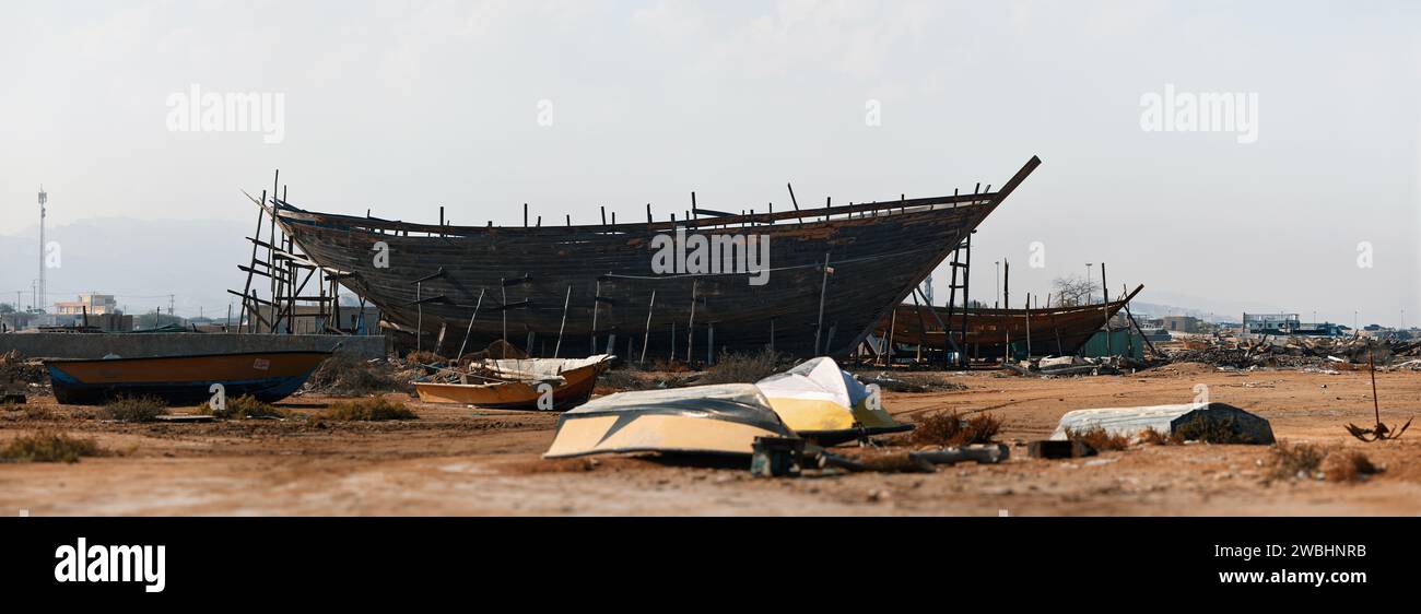 Construction of a wooden ship. Shipyard of traditional Dhow wooden boat ...