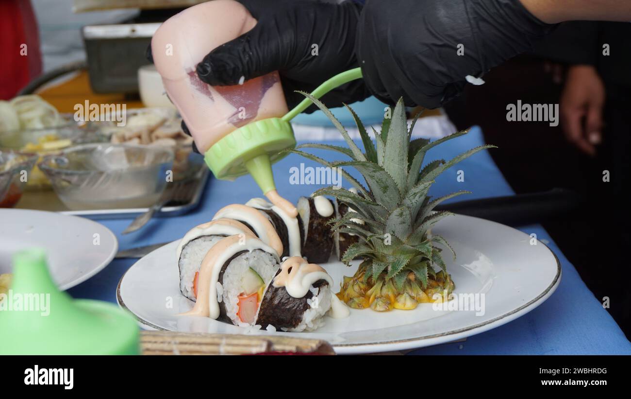 Chef preparing Japanese food. Japanese chef making sushi for customers ...