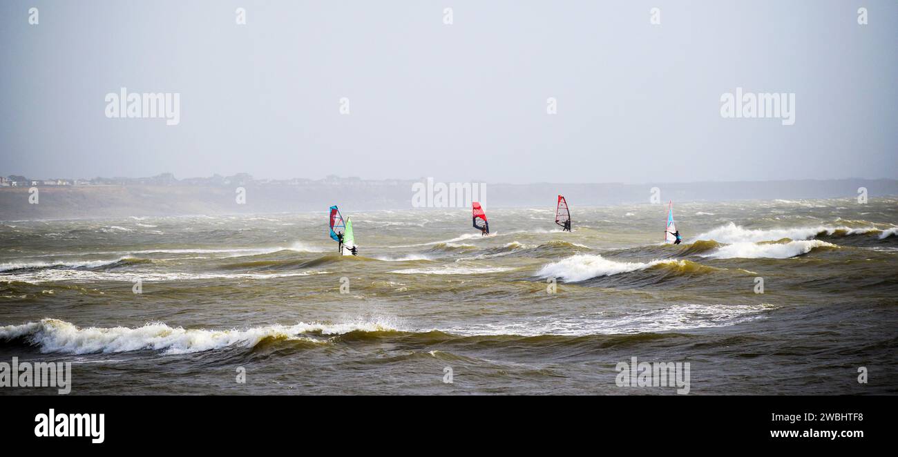 Windsurfers enjoying gale force winds and waves Stock Photo - Alamy