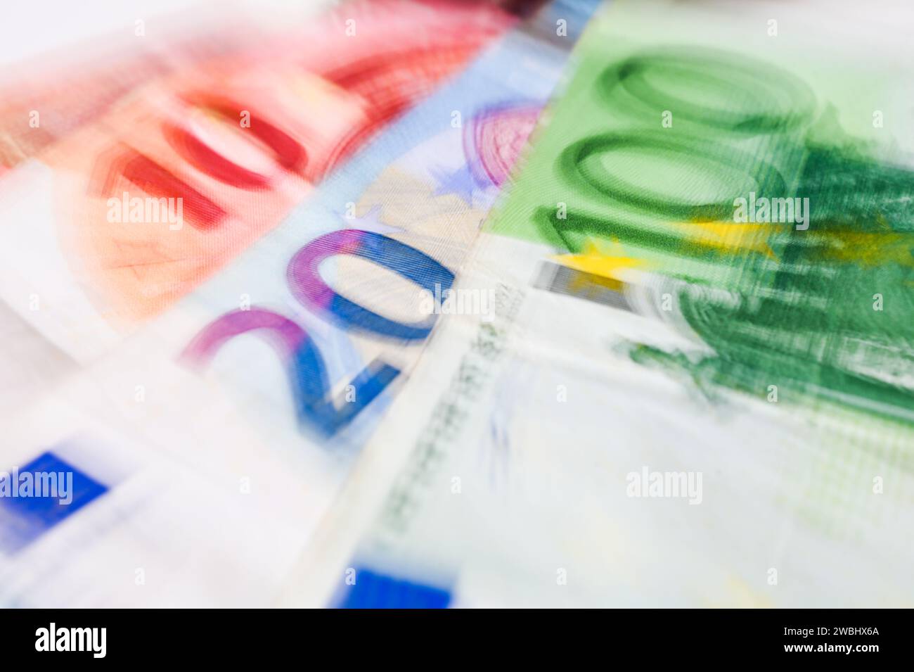 Euro banknotes, close up. Blurred EU currency. 100, 20 and 10 euro note ...