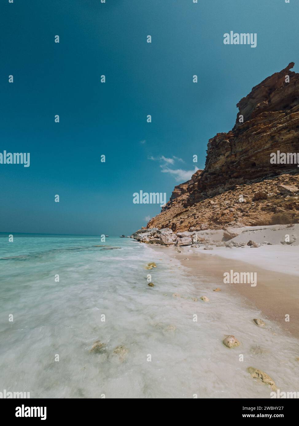 Turquoise waves gently lapping against the pristine sandy shores of ...