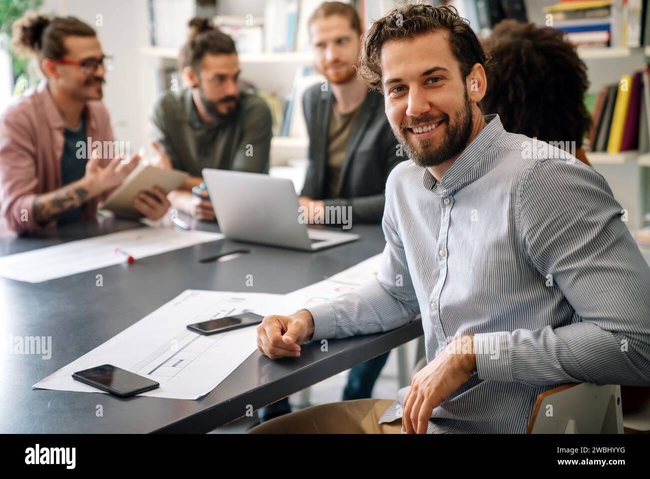 During corporate morning briefing multiethnic staff listen to project ...