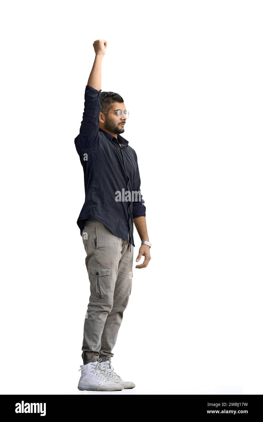A man, on a white background, in full height, raised his hand Stock ...