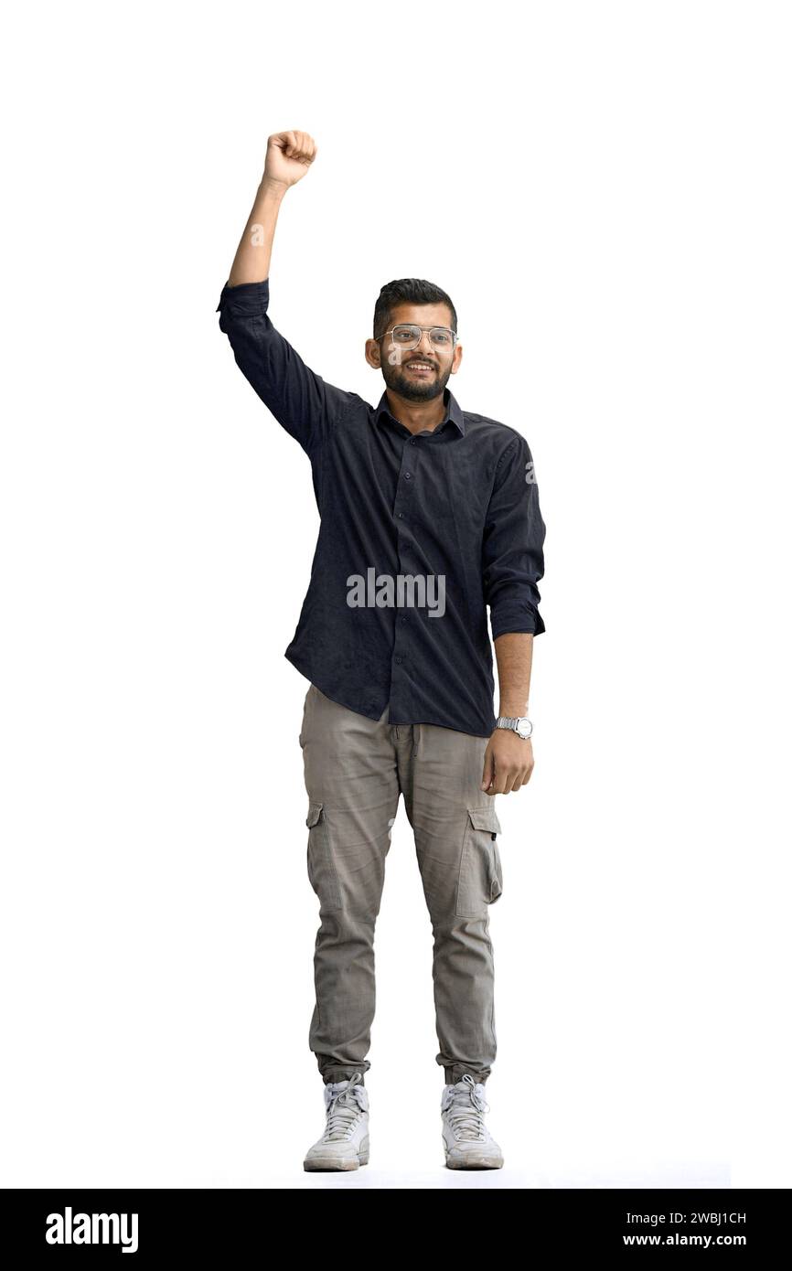 A man, on a white background, in full height, raised his hand Stock ...