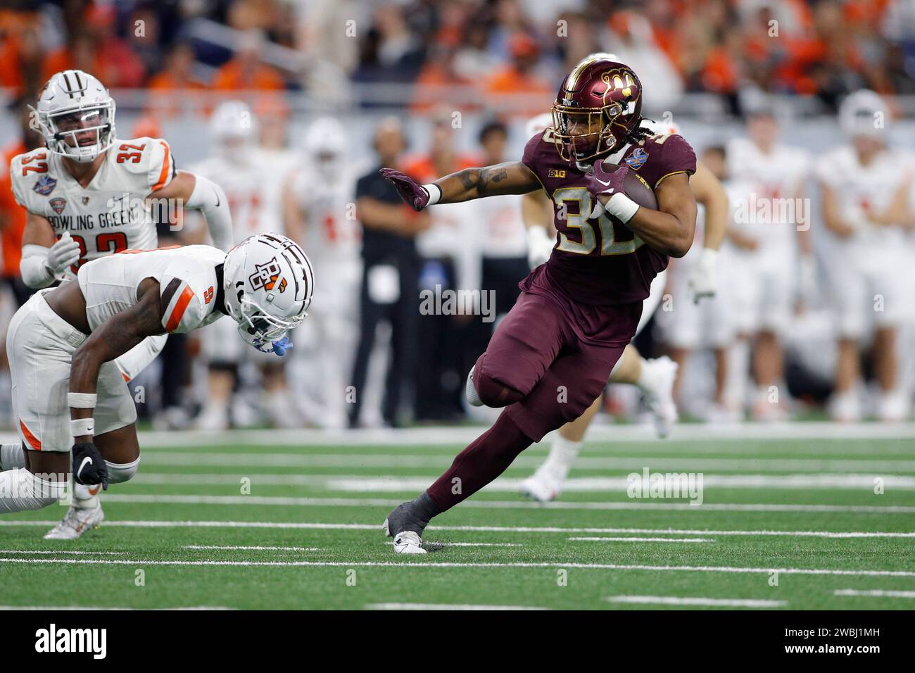 Minnesota running back Jordan Nubin (30), right, runs against Bowling ...