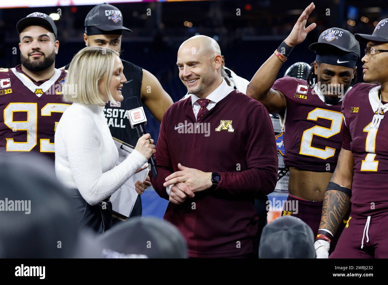 Minnesota coach P.J. Fleck, center, is interviewed following the Quick ...