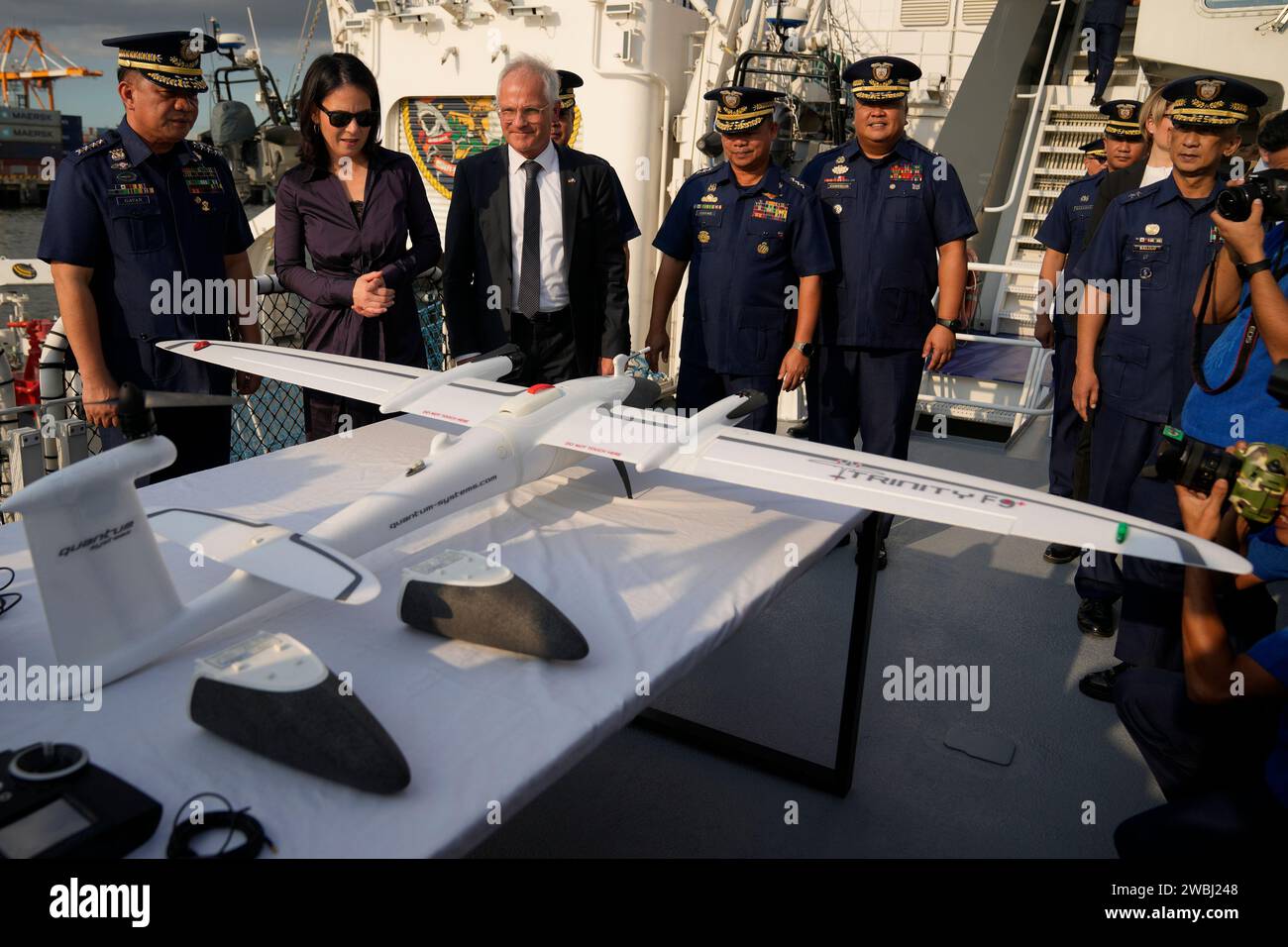 German Foreign Minister Annalena Baerbock, second from left, talks with ...