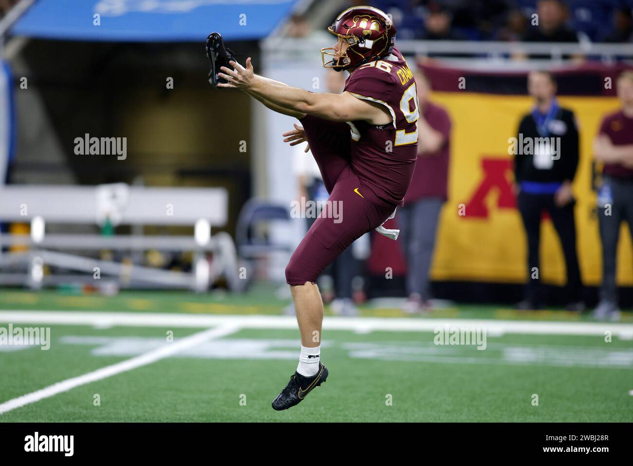 Minnesota punter Mark Crawford punts during the Quick Lane Bowl NCAA ...