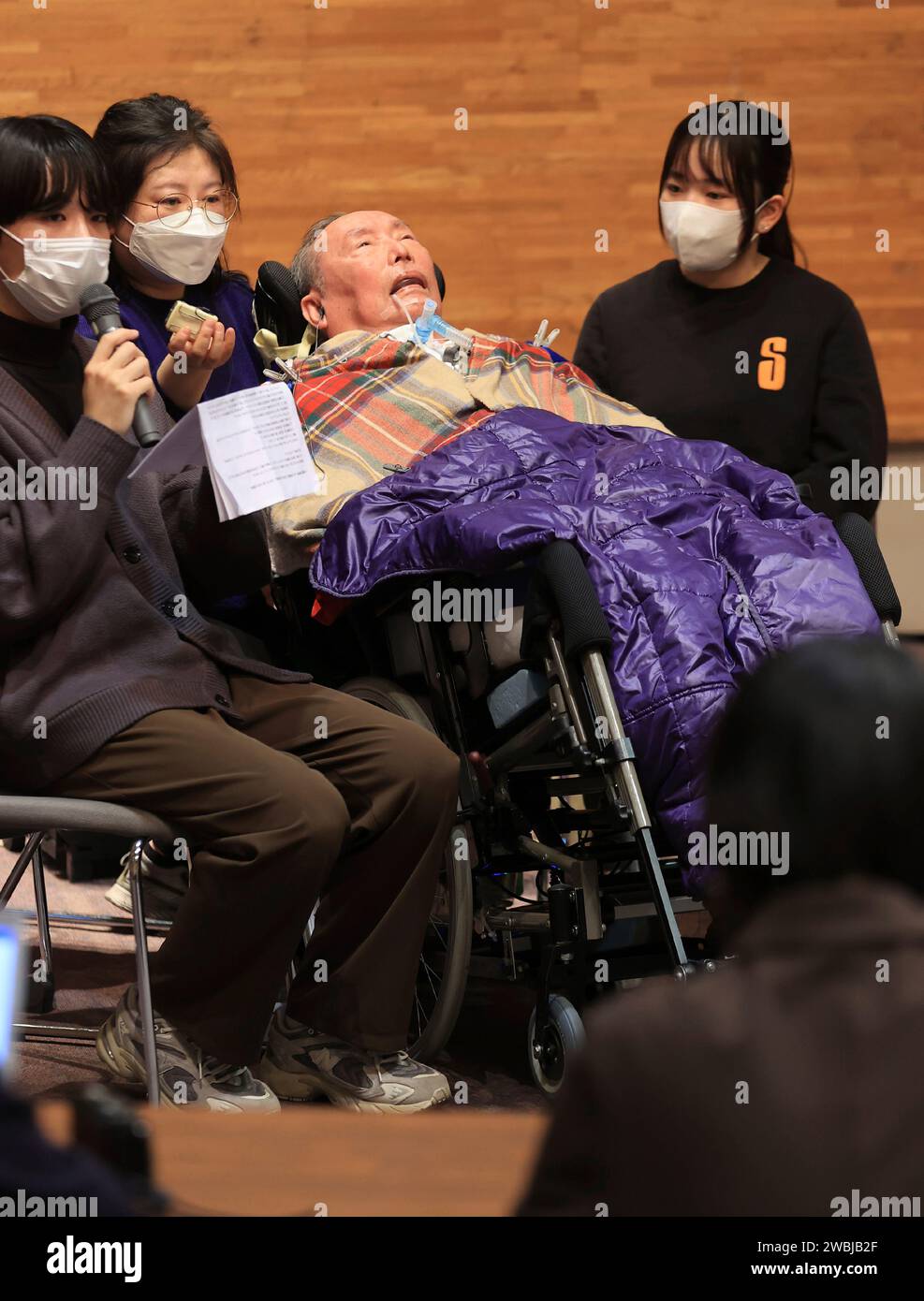 Hideaki Masuda, a consultant for the Japan ALS Association, lets his ...