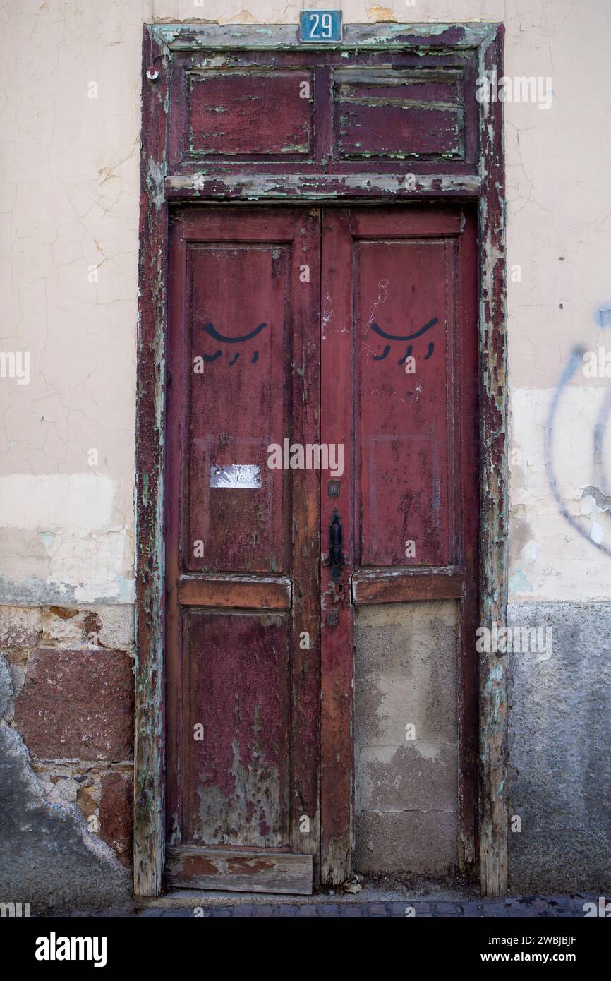 Old and colorful wooden door of a building Stock Photo - Alamy
