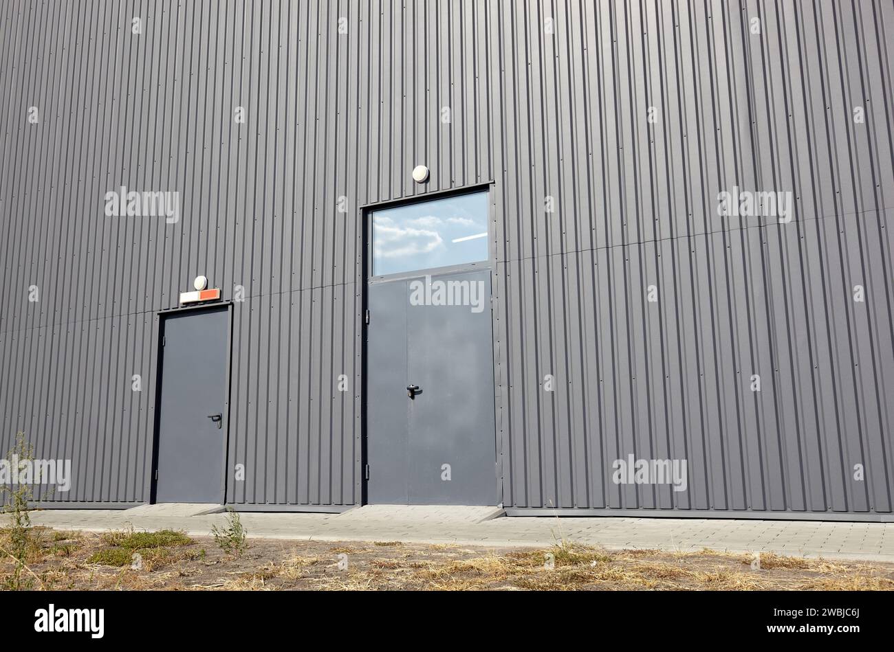 Corrugated steel warehouse or factory industrial building. Architecture ...