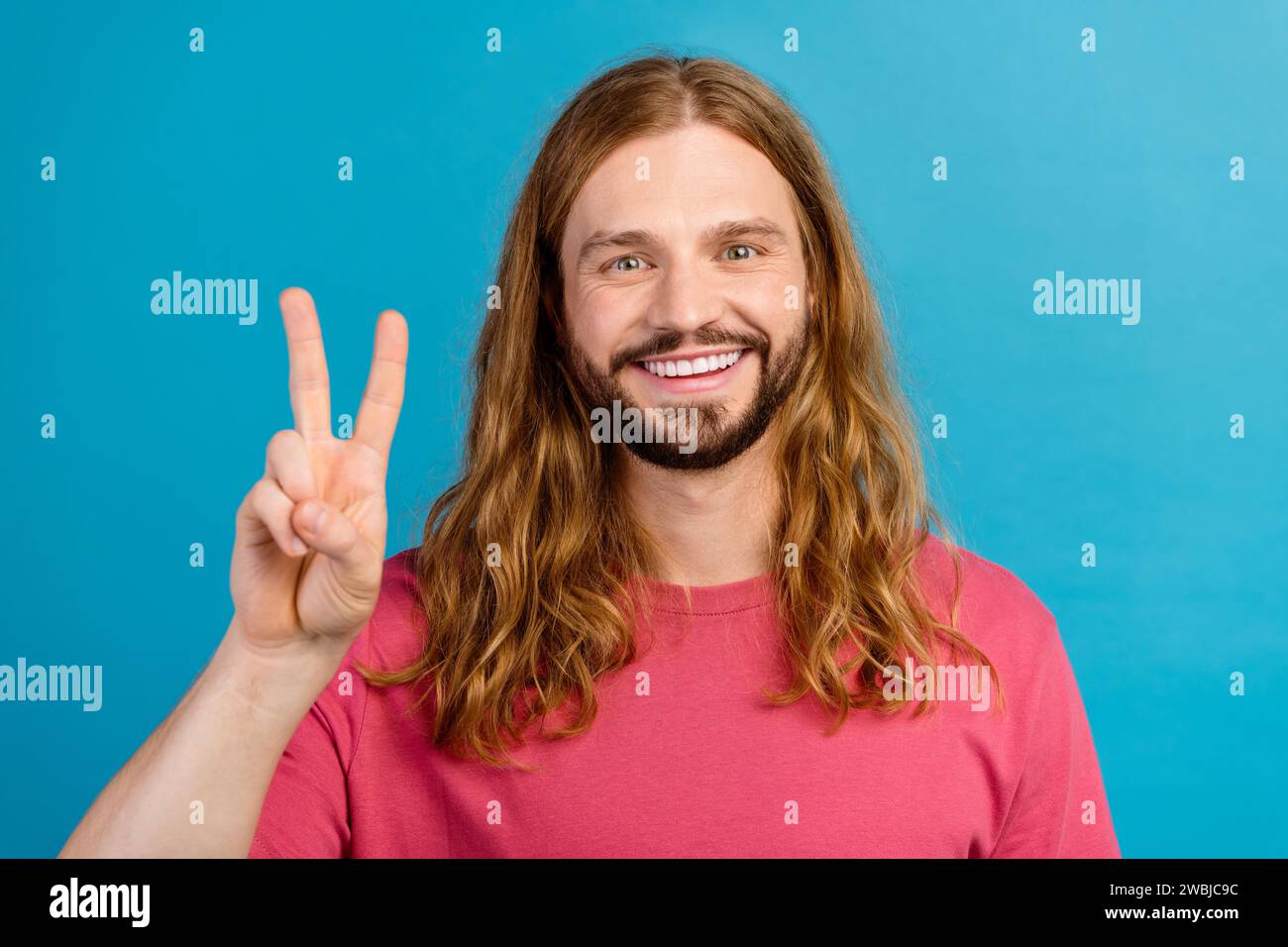Portrait of positive person beaming smile hand fingers demonstrate v ...