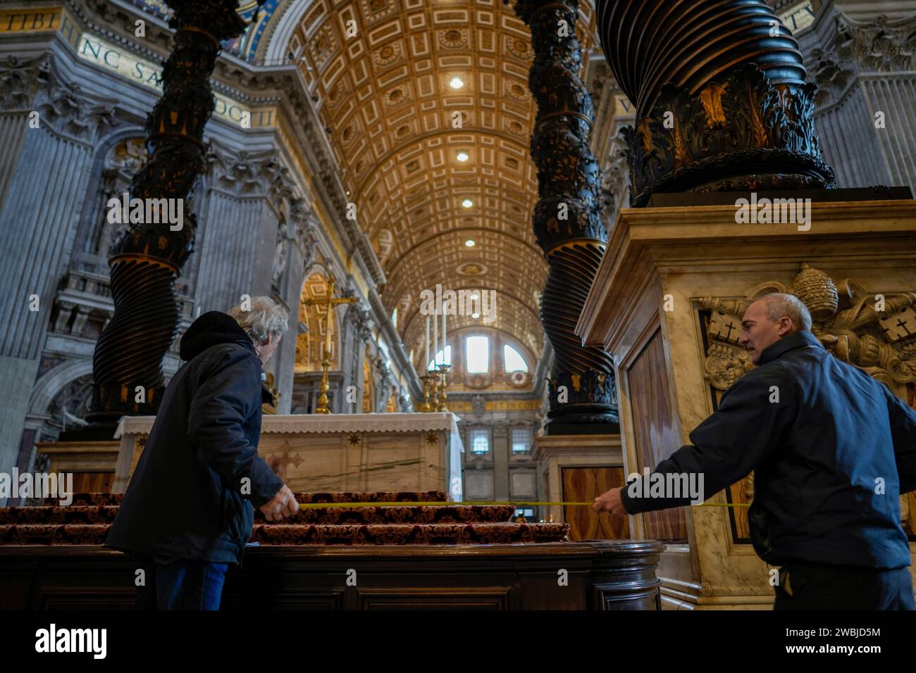Workmen take measurements at the base of the 17th century, 95ft-tall ...