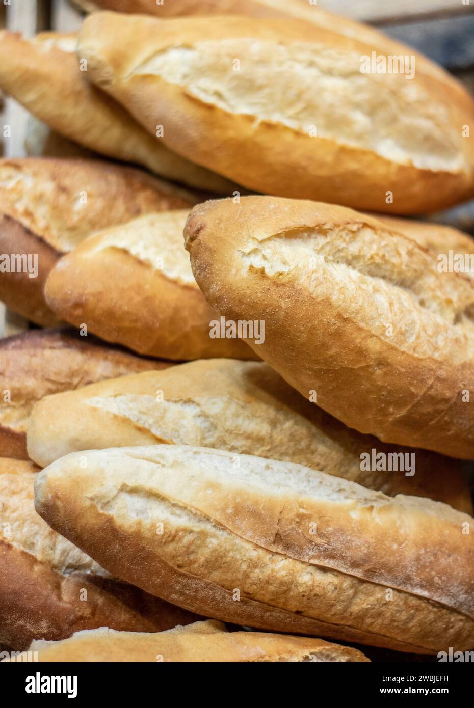Display of handmade bread loaves on the counter top of a modern bakery ...