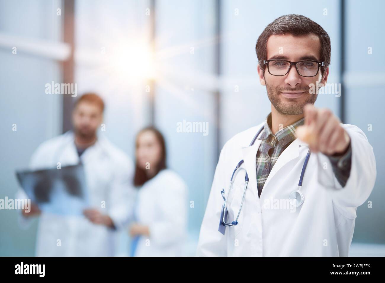 Doctor pointing finger serious expression hi-res stock photography and ...
