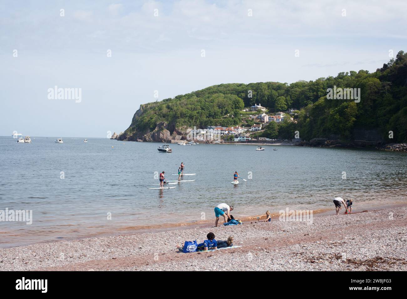 Houses overlooking Babbacombe Beach and people on Oddicombe Beach in ...