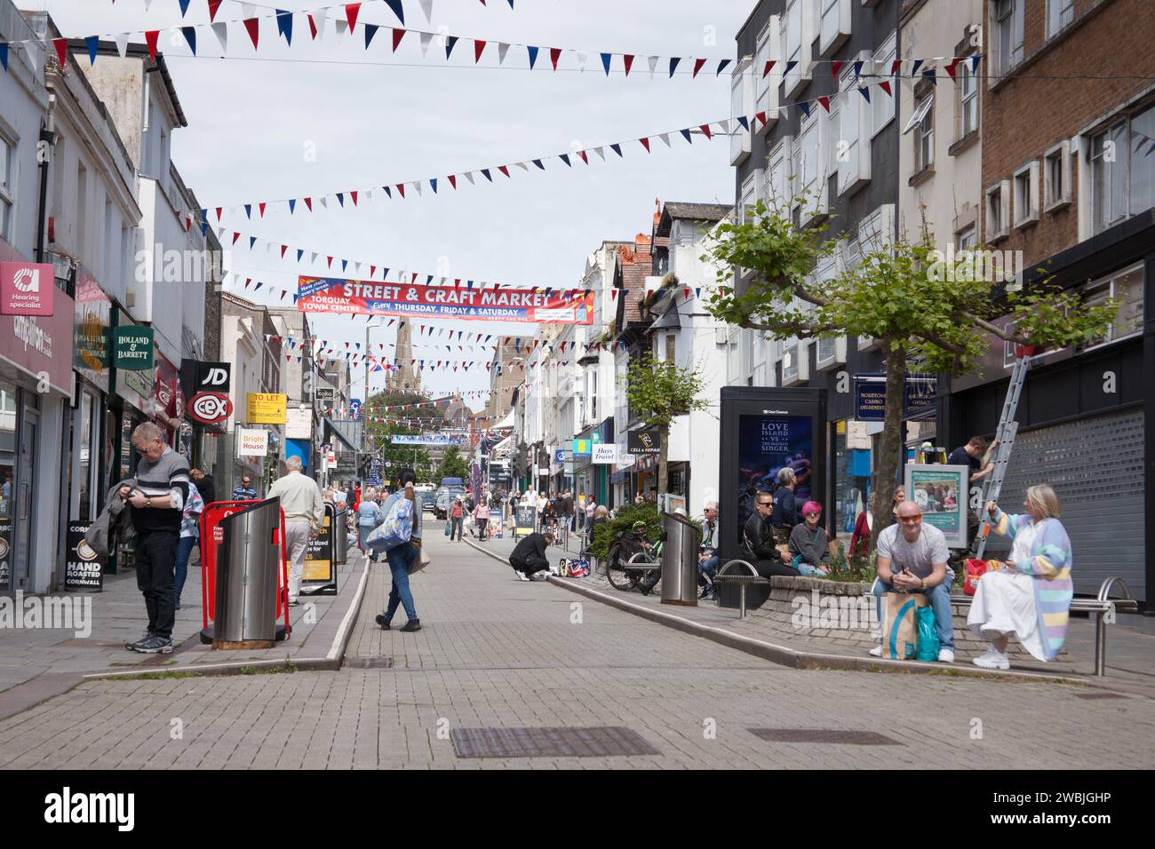 Shops and shoppers on Union Street, Torquay in Devon in the United ...