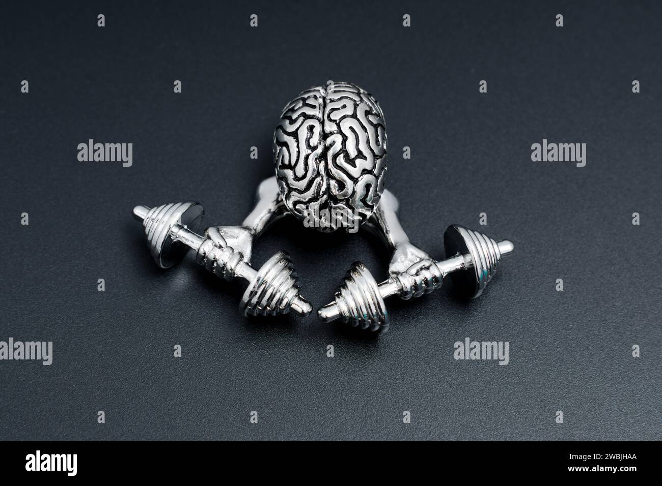 Close-up view of a human brain elevating heavy dumbbells. Creative ...