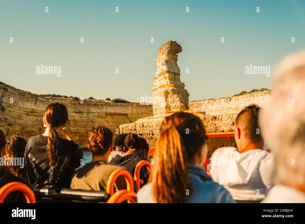Tourist in the boat admiring rock formation called submarine, Albufeira ...
