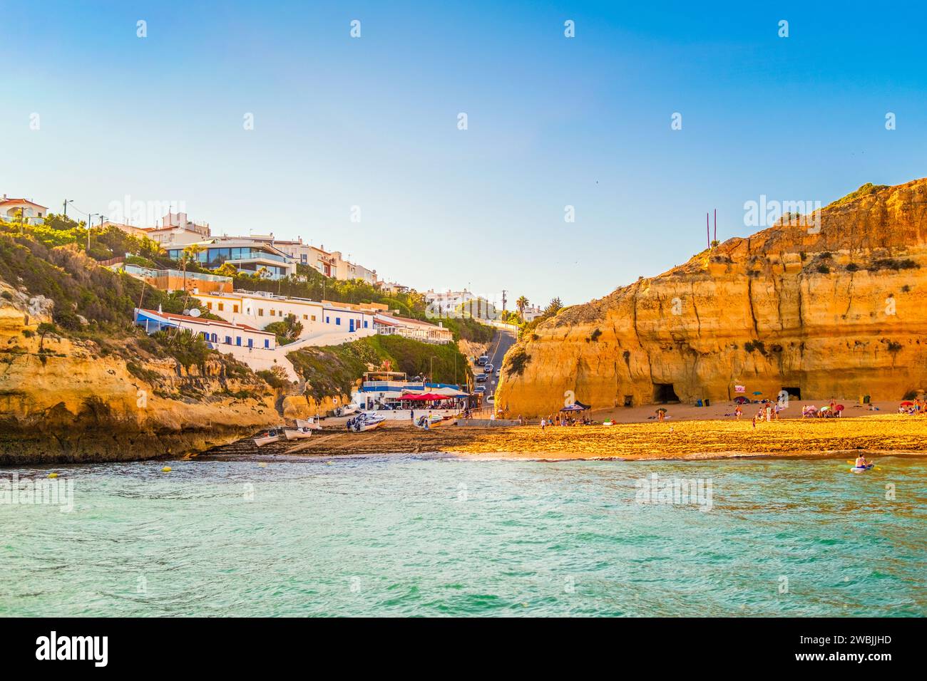 Beautiful limestone cliff Algarve coast with village of Benagil, south ...