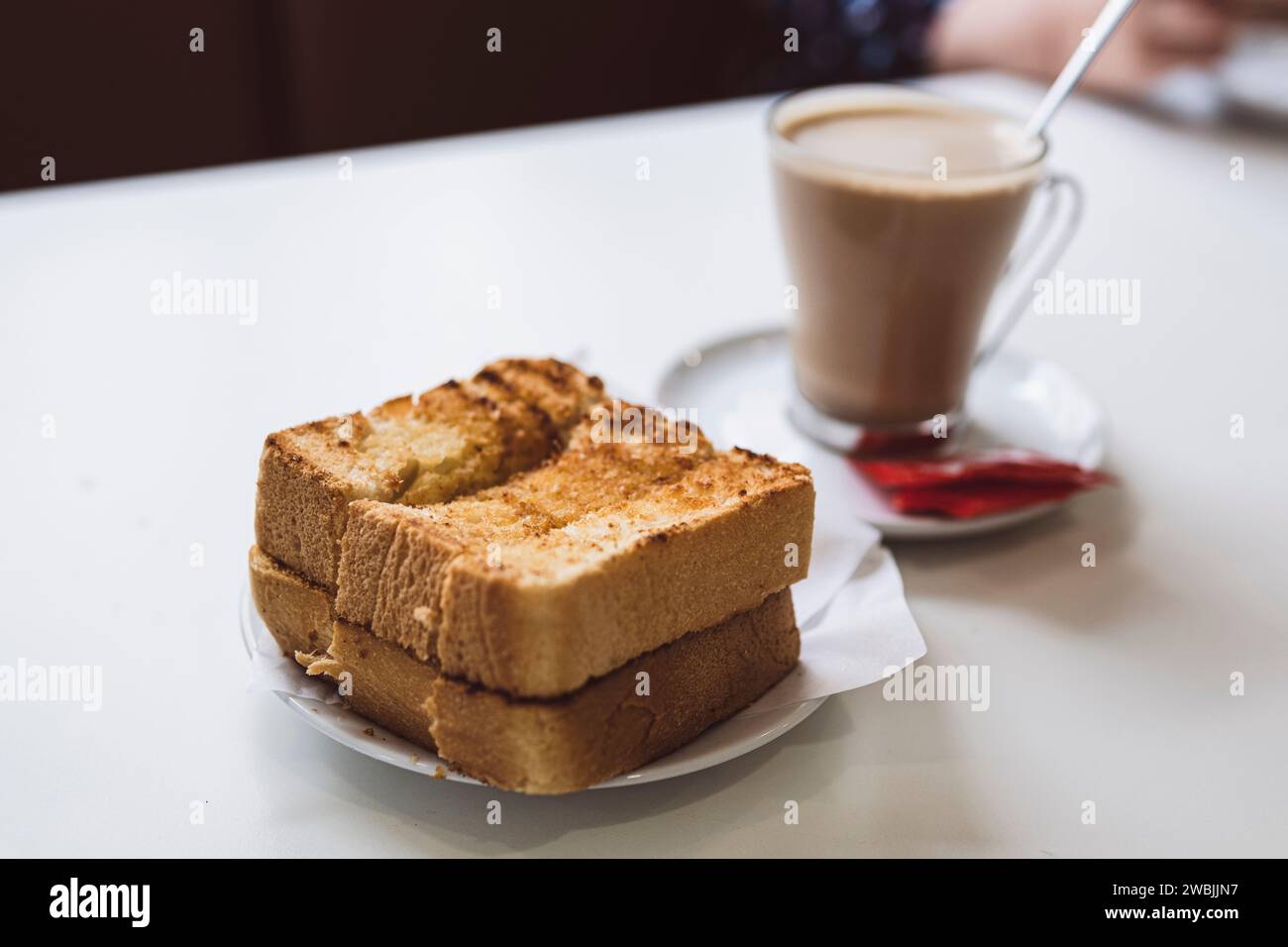 Traditional Portuguese breakfast - toasted loaf bread with butter and ...