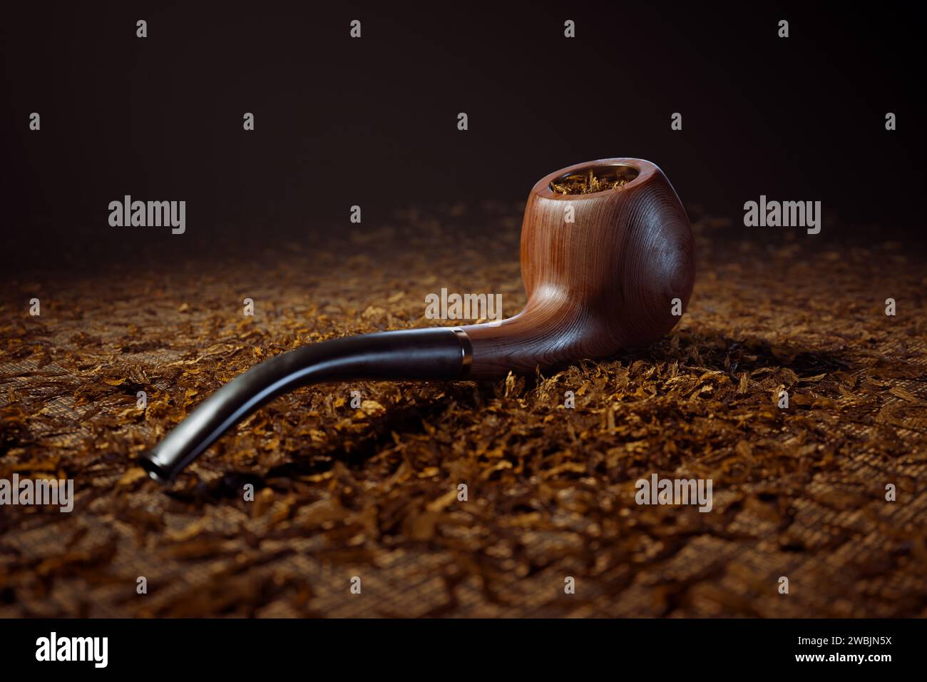 A close-up view showcases the fine details of a vintage mahogany pipe ...