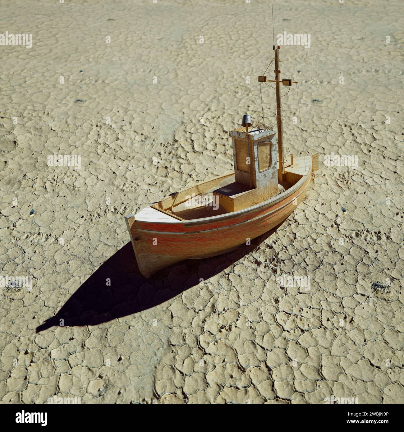Stark image of an isolated wooden boat on desolate cracked ground ...