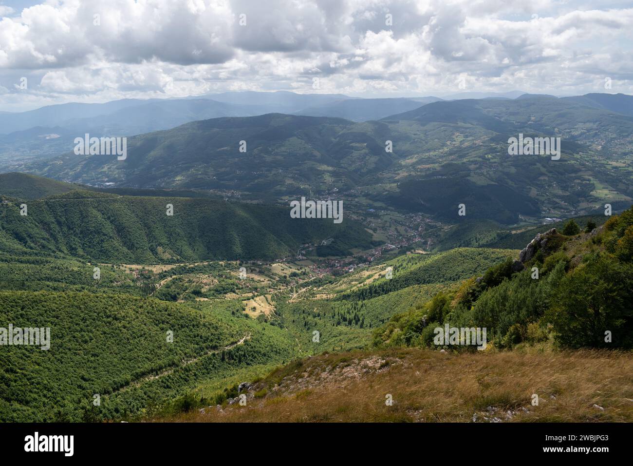 Landscape with mountains and villages in valley during sunny day with ...