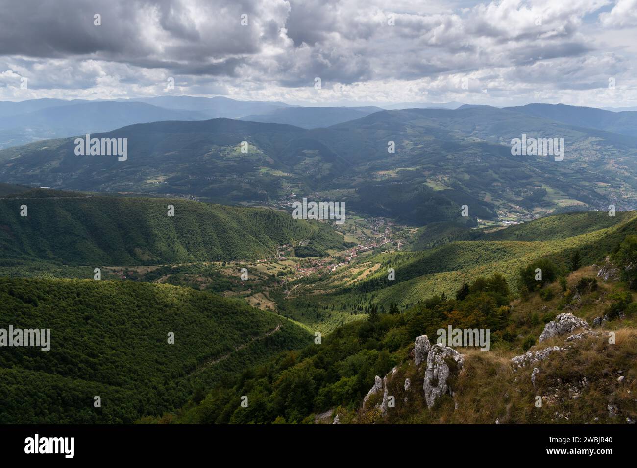 Landscape with mountains and villages in valley during sunny day with ...