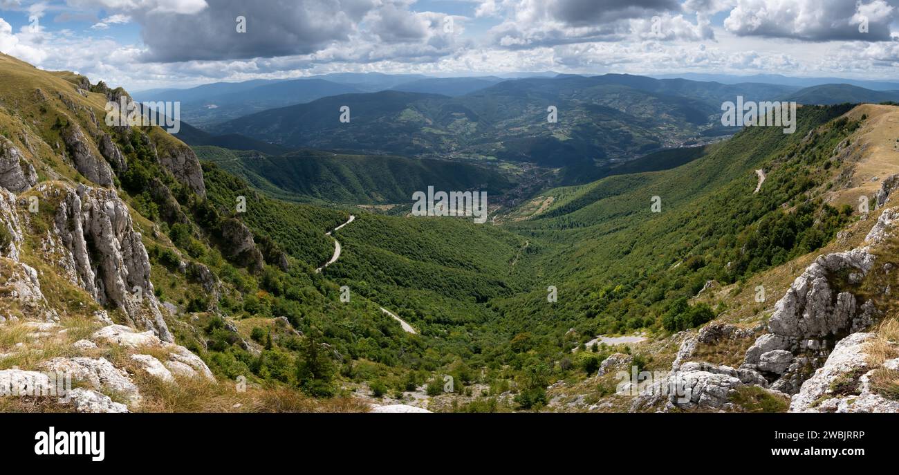 Mountain landscape with view toward valley during sunny day with ...