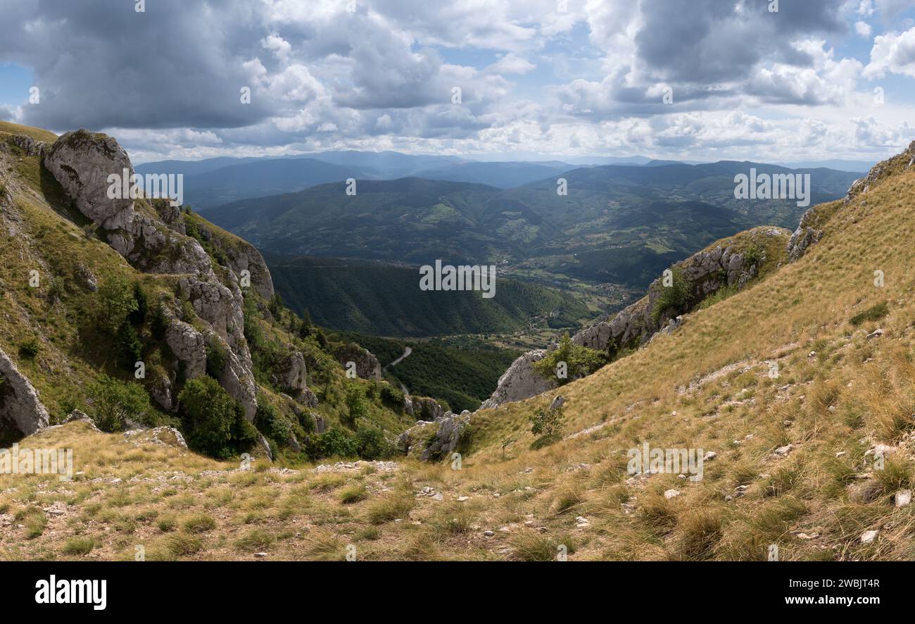 Mountain landscape with view toward valley during sunny day with ...