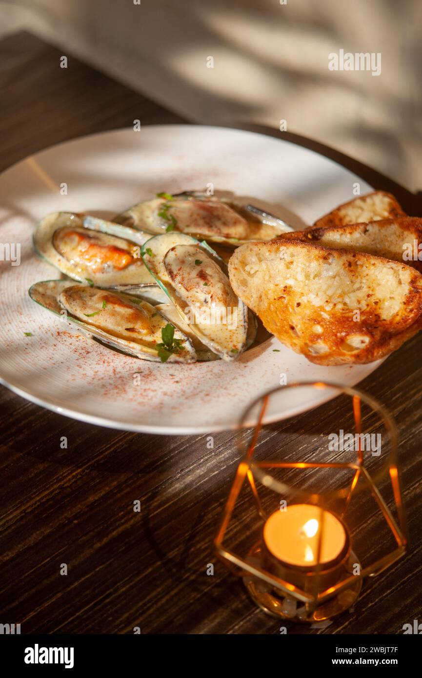 Sitting at a table on a beach hi-res stock photography and images - Alamy