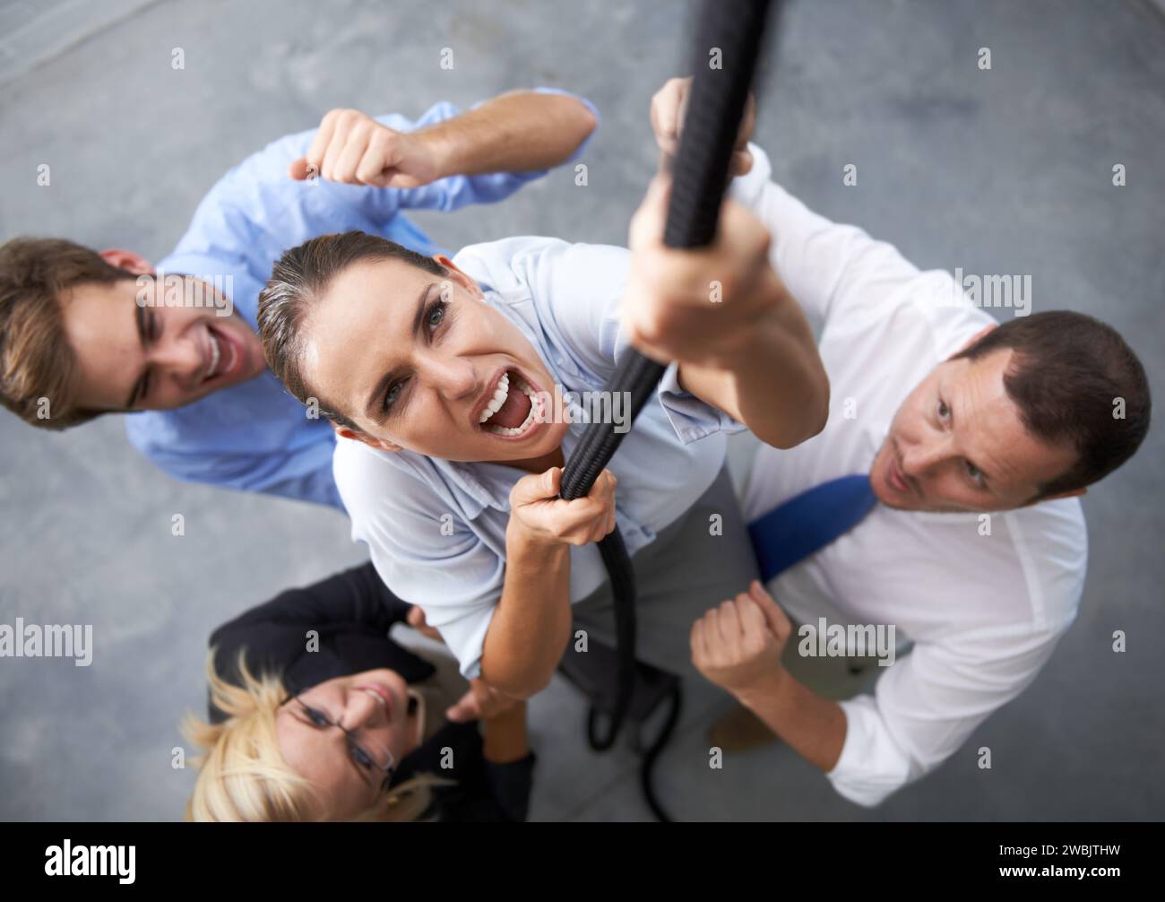 Team helping leader climb hi-res stock photography and images - Alamy