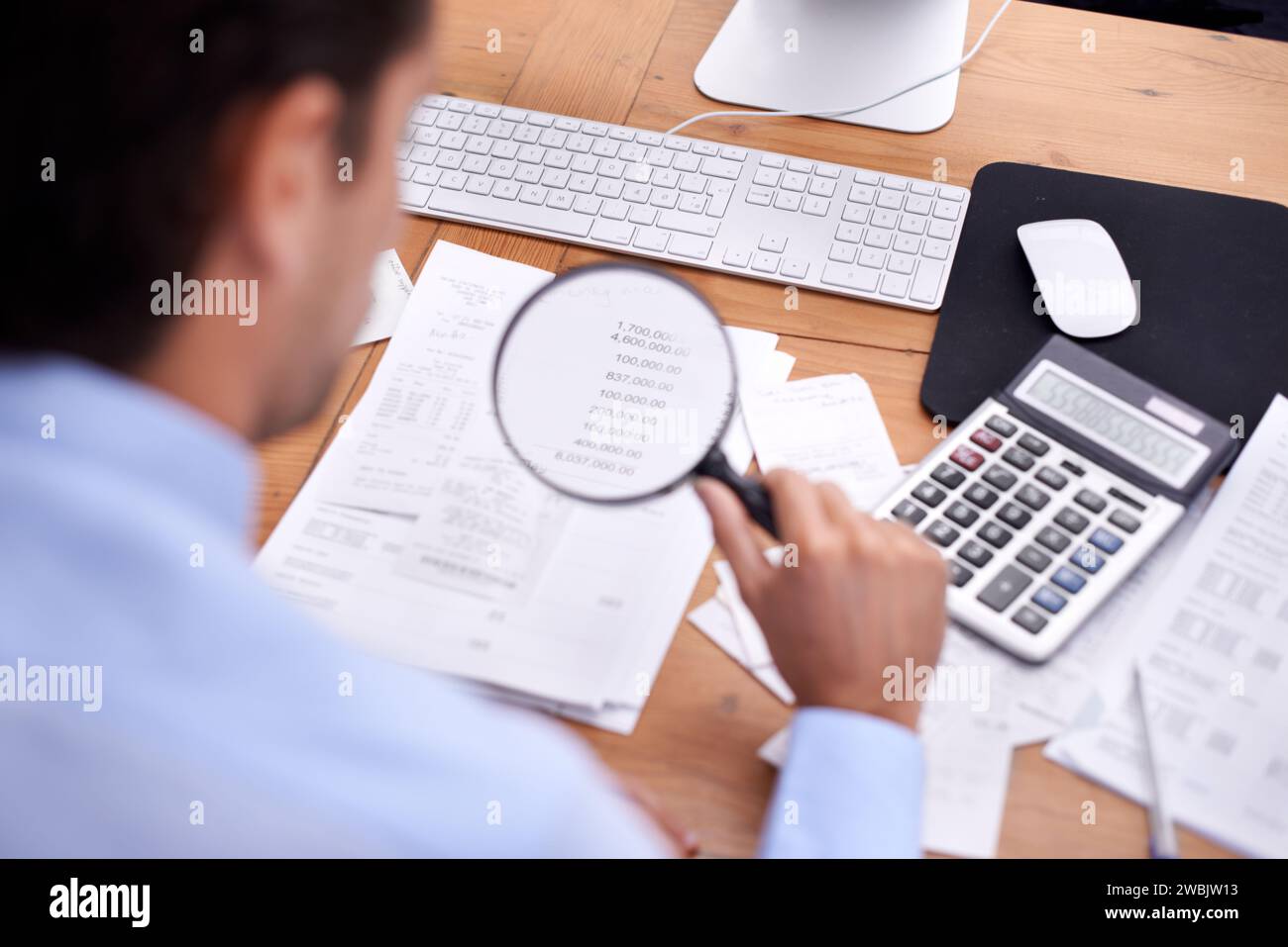 Finance, businessman and magnifying glass in office with bookkeeper ...