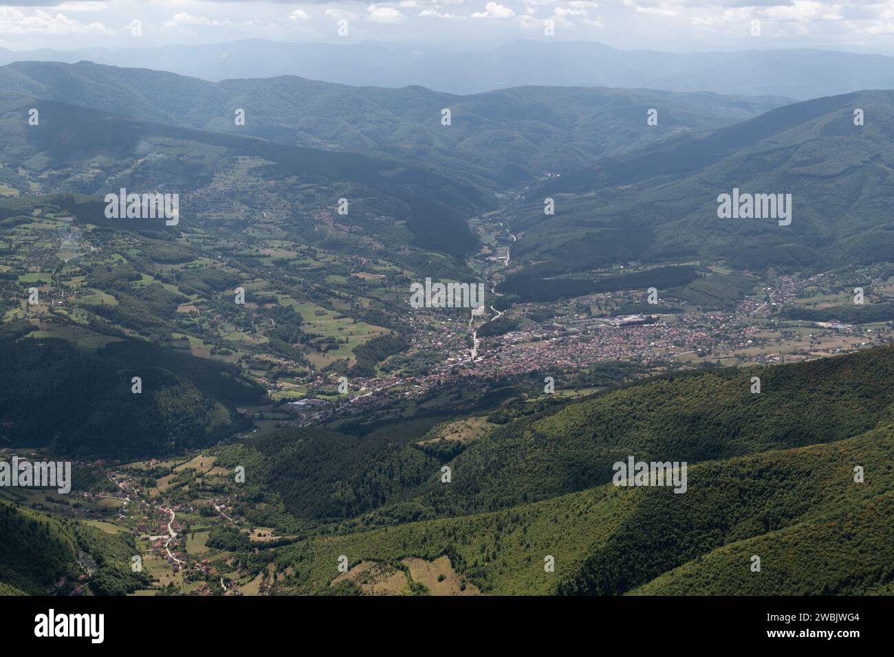 Landscape with mountains and villages in valley during sunny day with ...