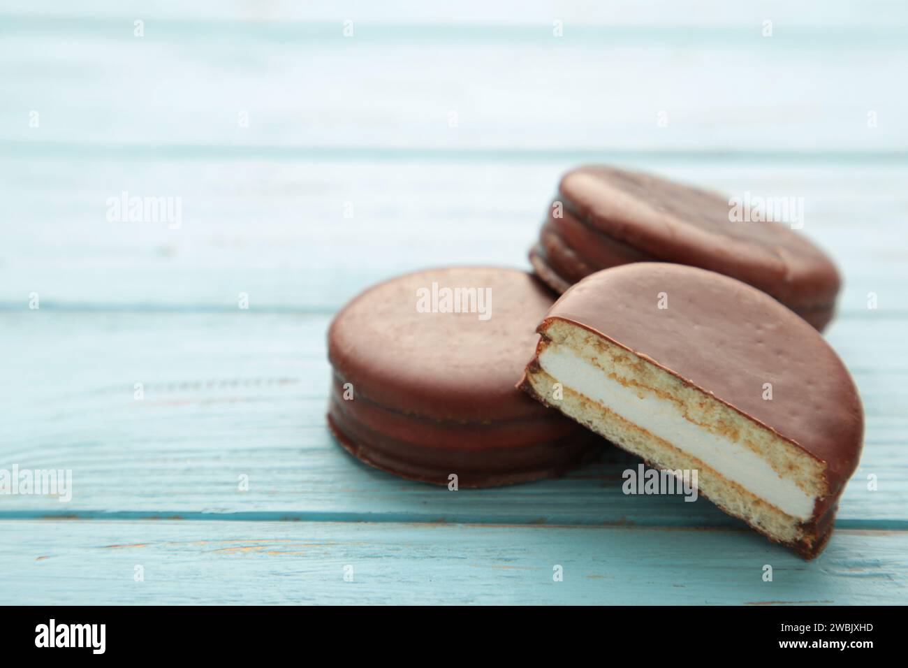 Choco pie chocolate coated snacks on blue background. Top view Stock ...