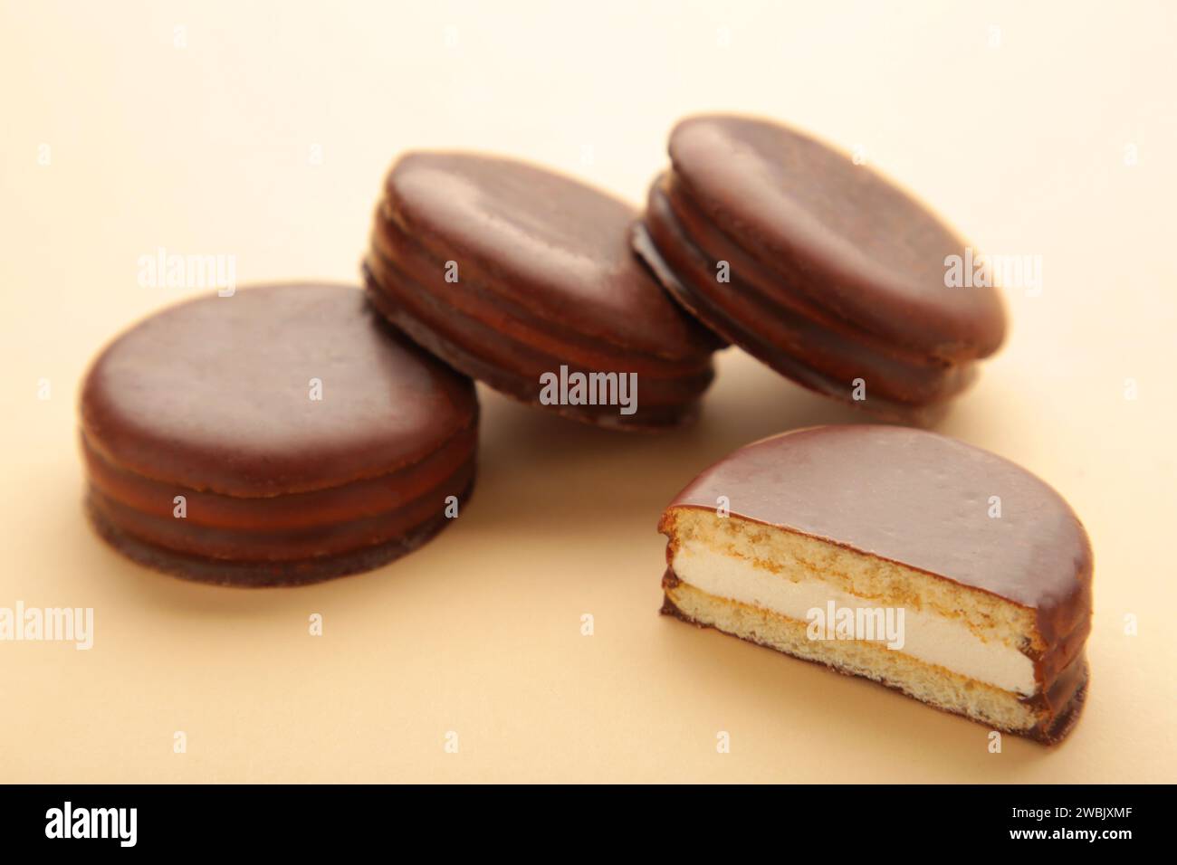 Choco pie chocolate coated snacks on beige background. Top view Stock ...