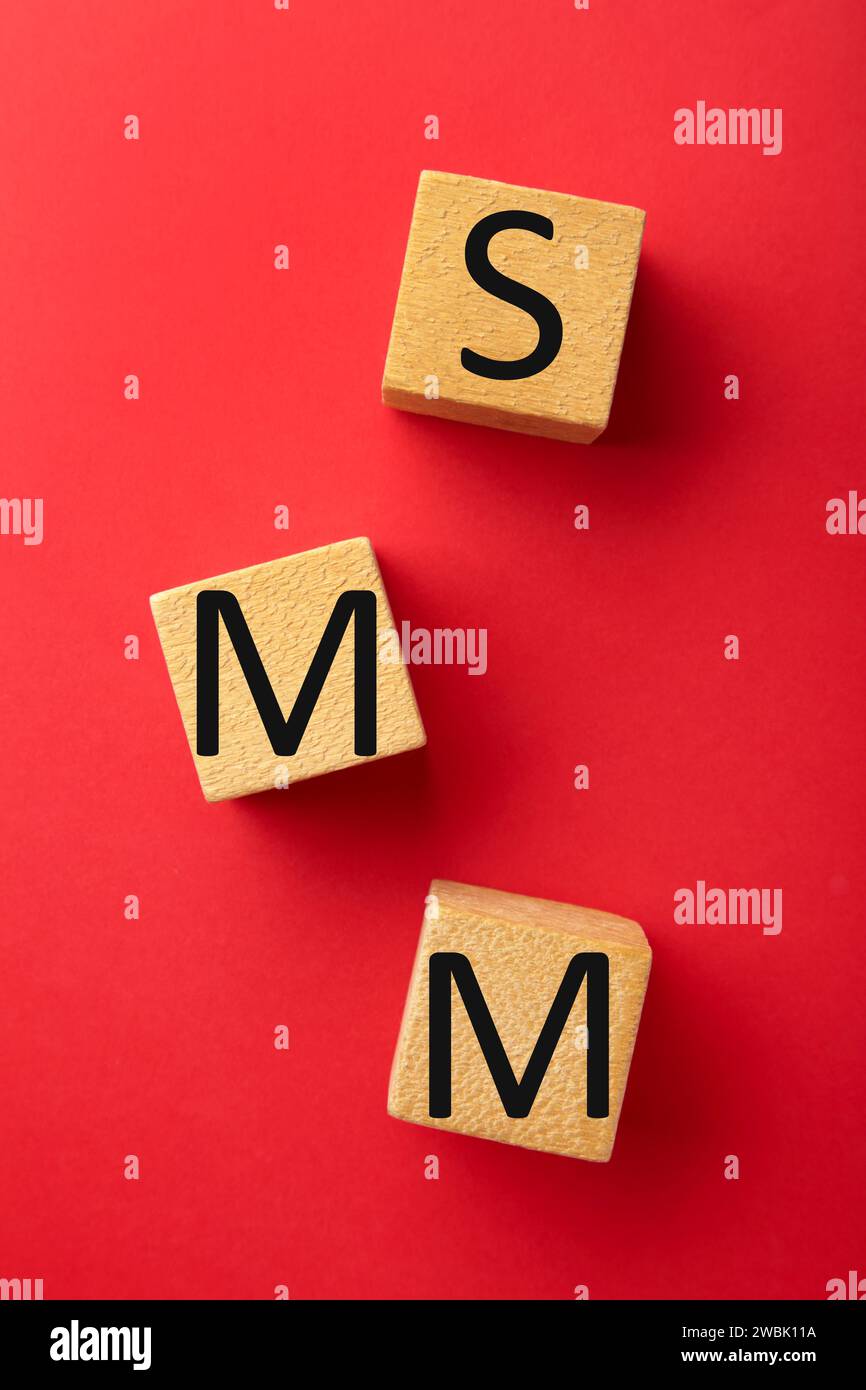Wooden cubes with word SMM on red background. Top view Stock Photo - Alamy
