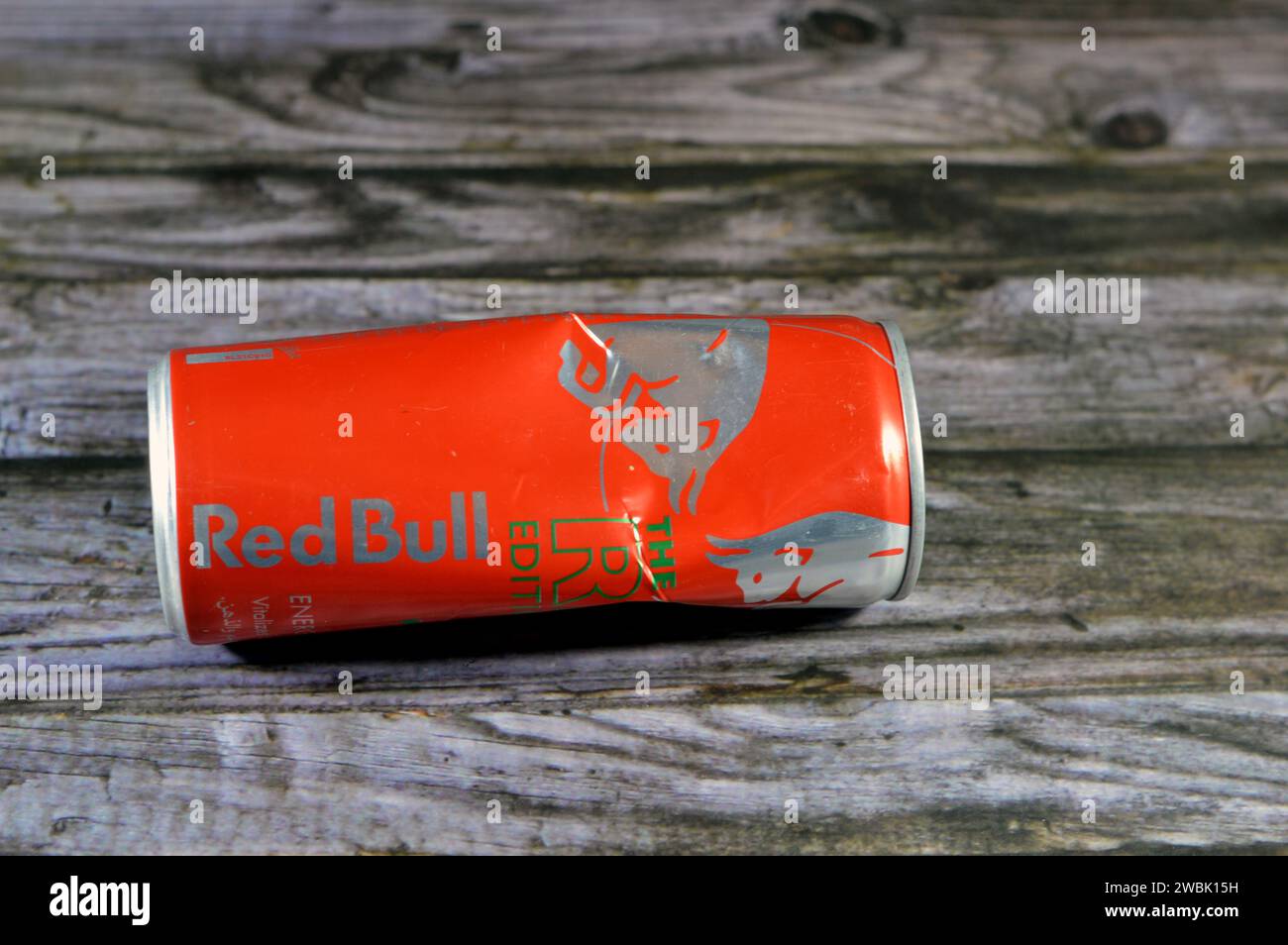 Cairo, Egypt, January 9 2024: Crushed dented Red Bull energy drink, a ...
