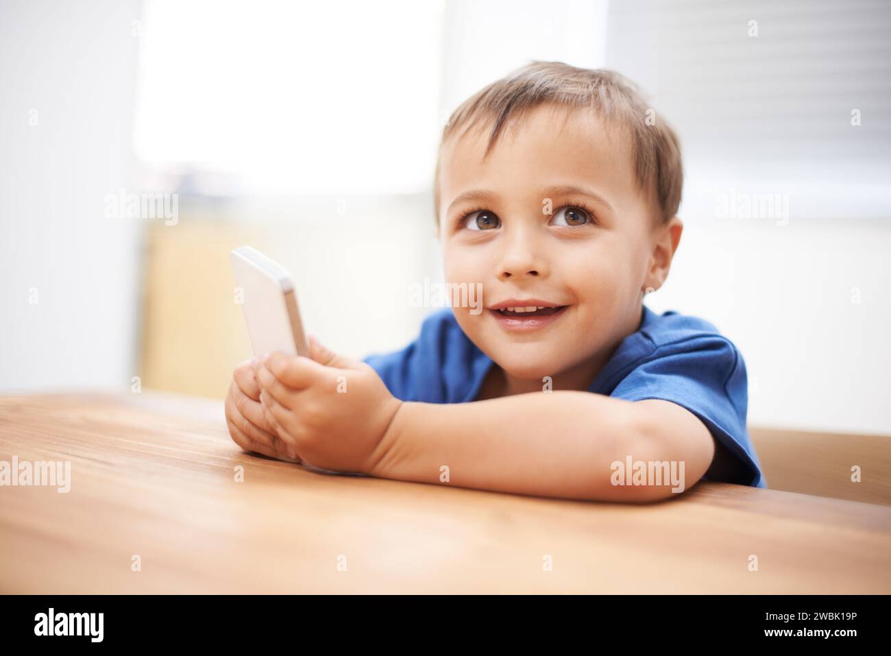 Child, boy and phone at home, happiness and communication with online ...