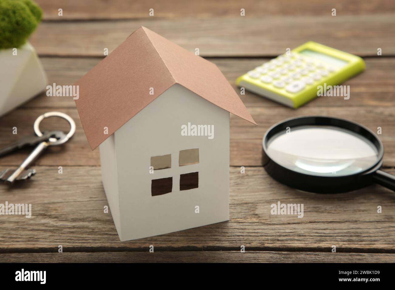 Paper house and key on grey background with copy space. Top view Stock ...